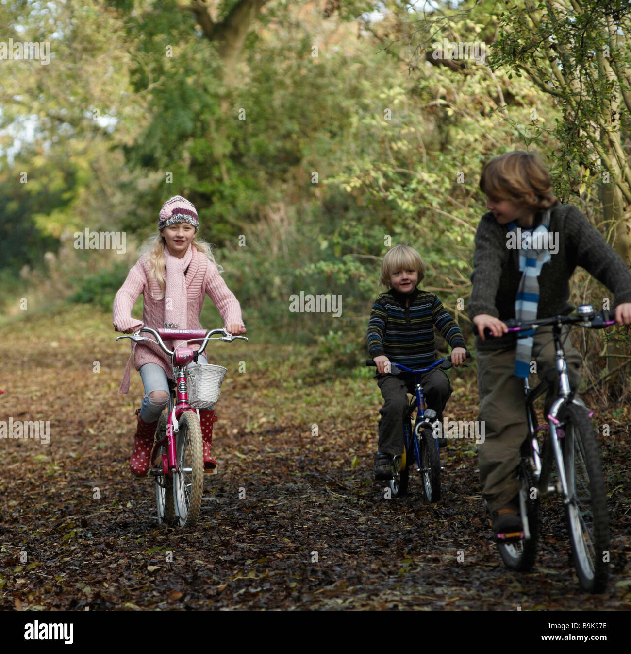 Children riding bikes in countryside Stock Photo - Alamy
