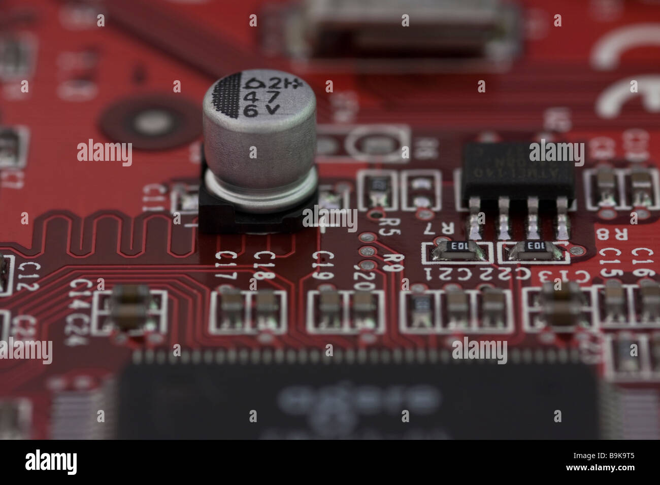 PC Board red chips surface mount solder bridge Stock Photo - Alamy
