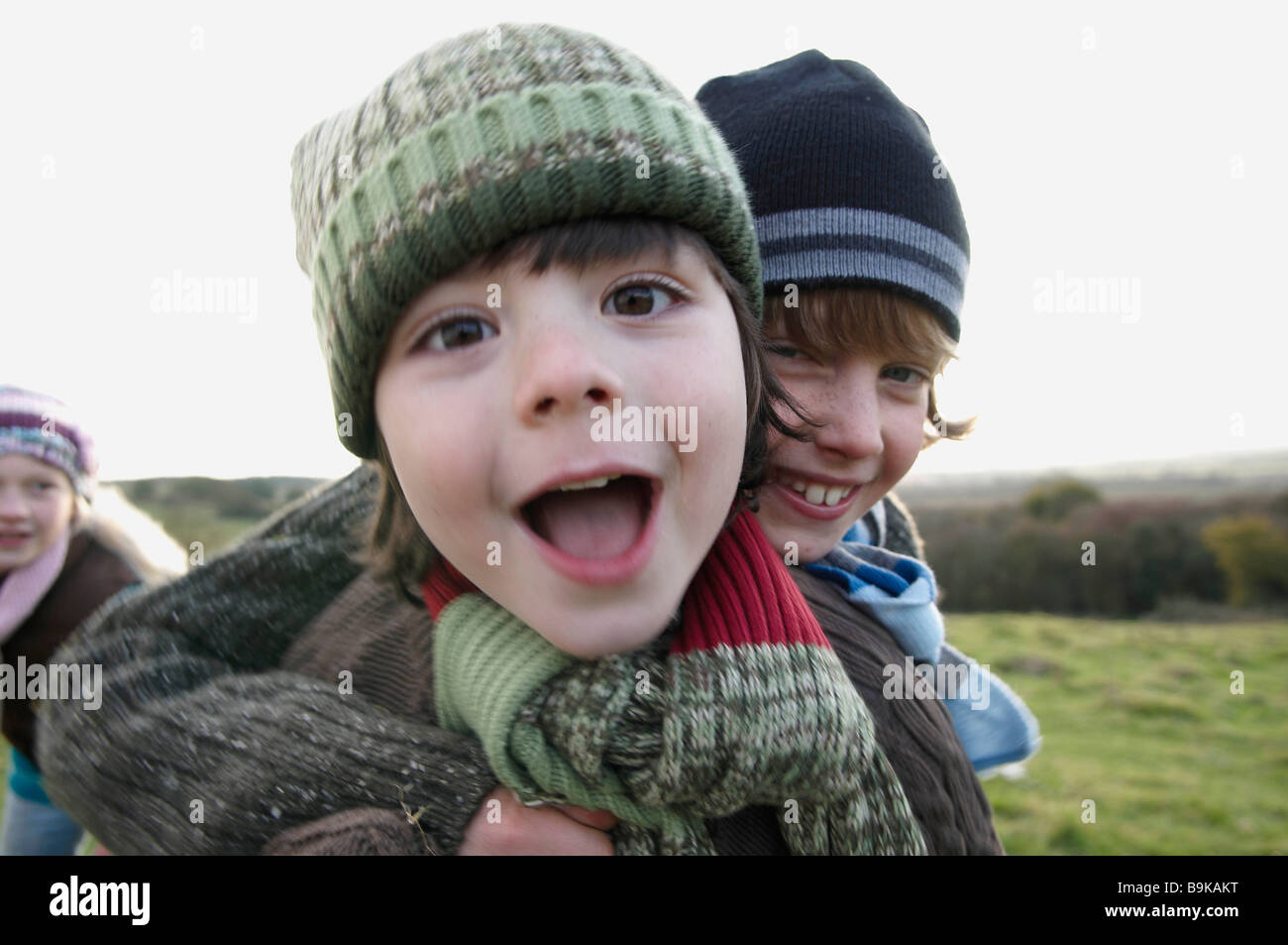 Two boys playing in field Stock Photo - Alamy