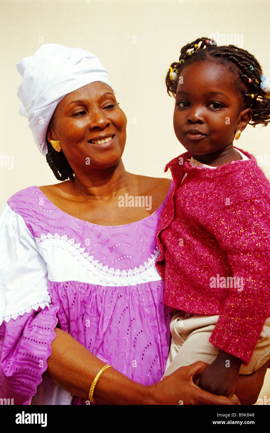 Senegal, woman wearing traditional bubu and her daughter Stock Photo ...