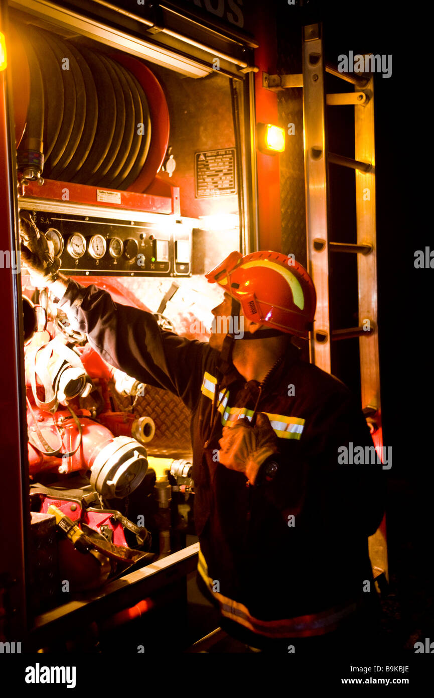 spanish fireman at firetruck Stock Photo - Alamy