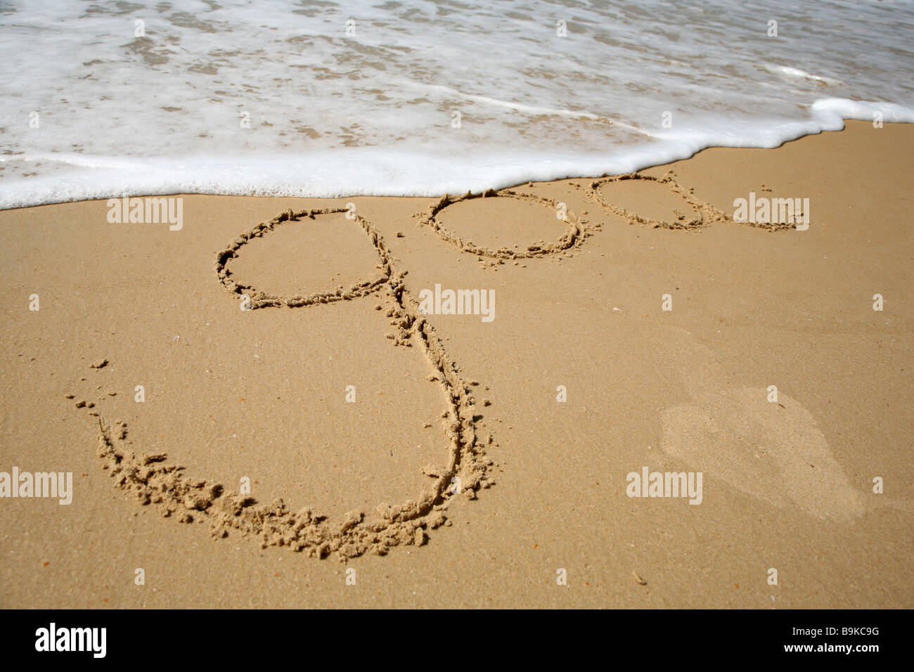 Goa written in the sand at Mobor Beach in Goa, India Stock Photo - Alamy