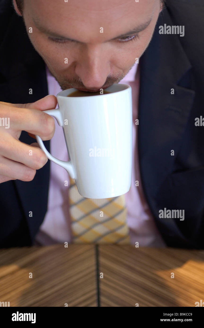businessman drinking tea Stock Photo - Alamy