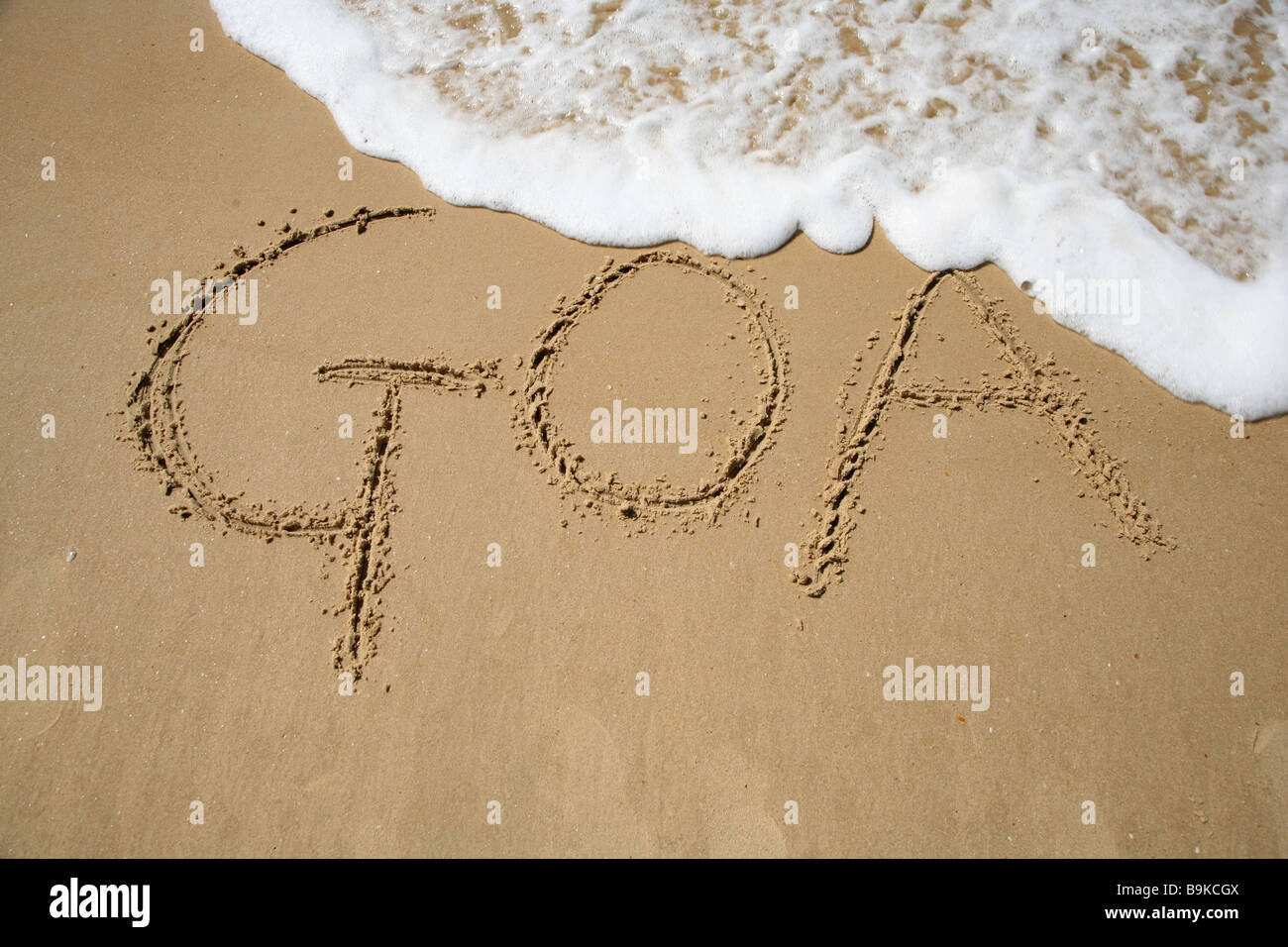 Goa written in the sand at Mobor Beach in Goa, India Stock Photo - Alamy
