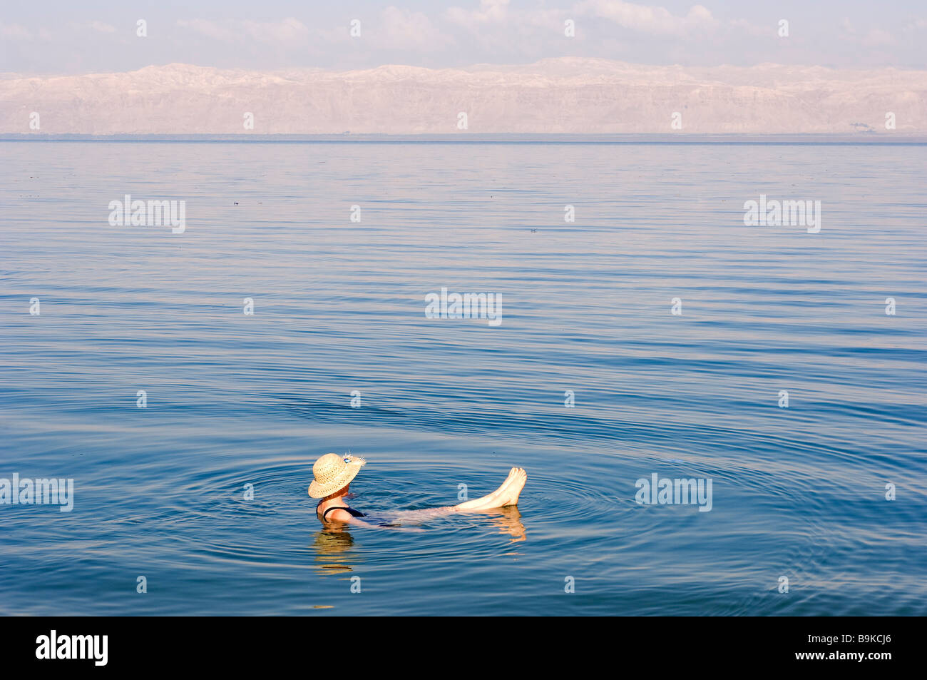 Woman floating in dead sea hi-res stock photography and images - Alamy