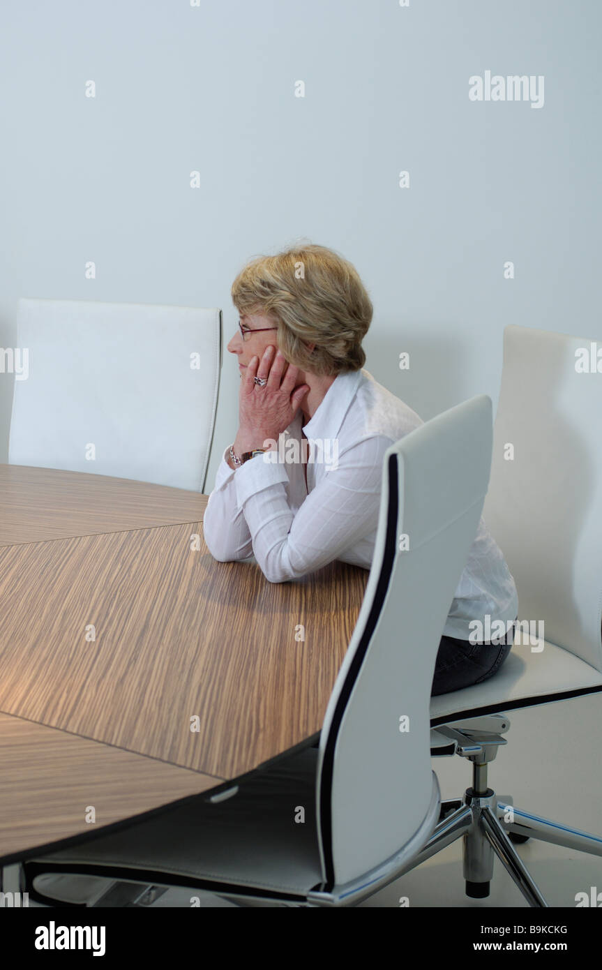 Sitting alone at boardroom table hi-res stock photography and images ...