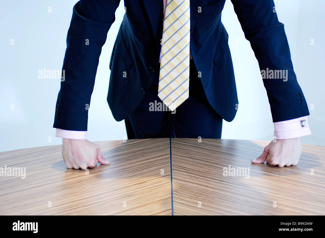 Business man leaning on table hi-res stock photography and images - Alamy