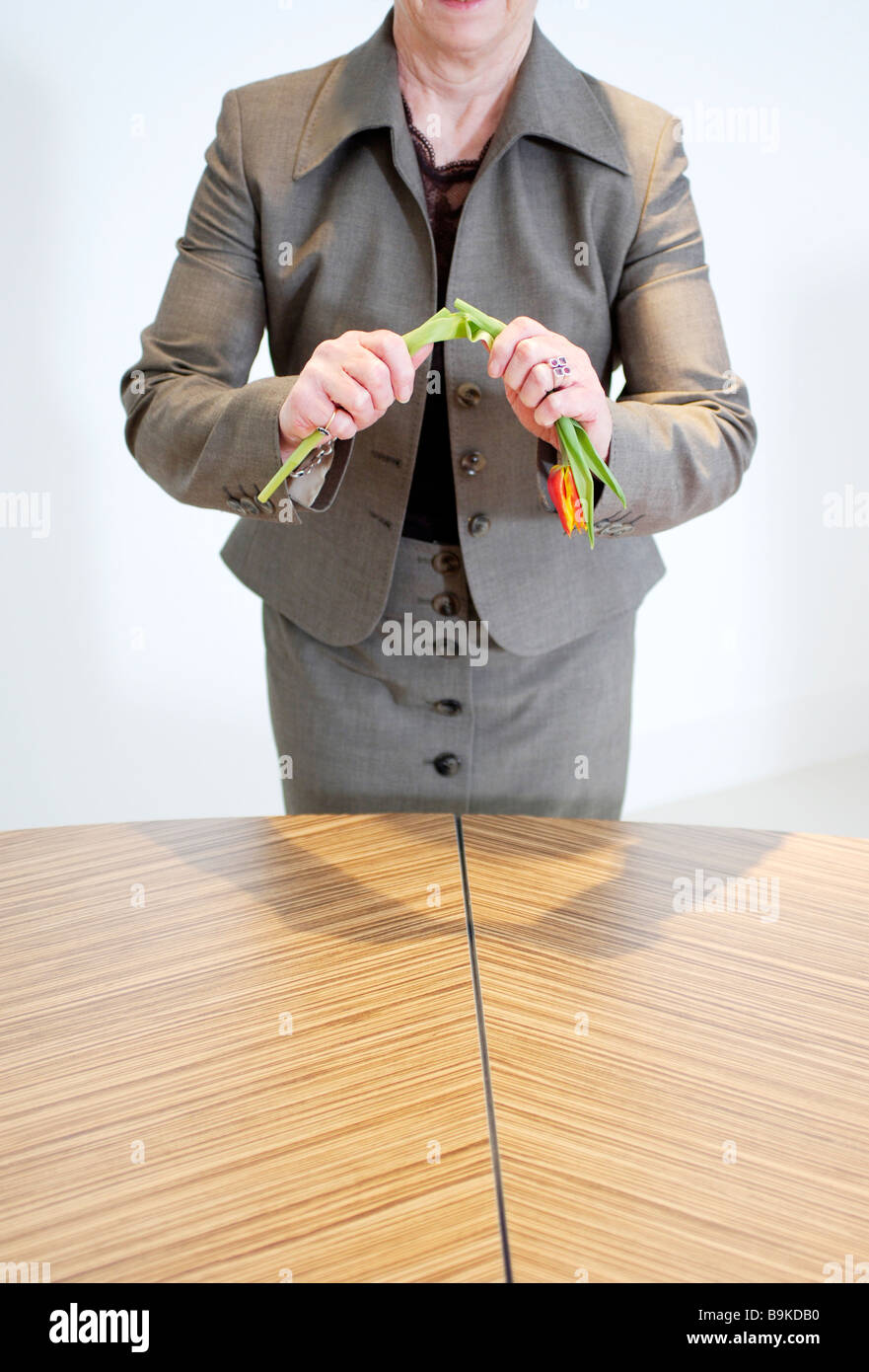 detail of woman breaking flower Stock Photo - Alamy