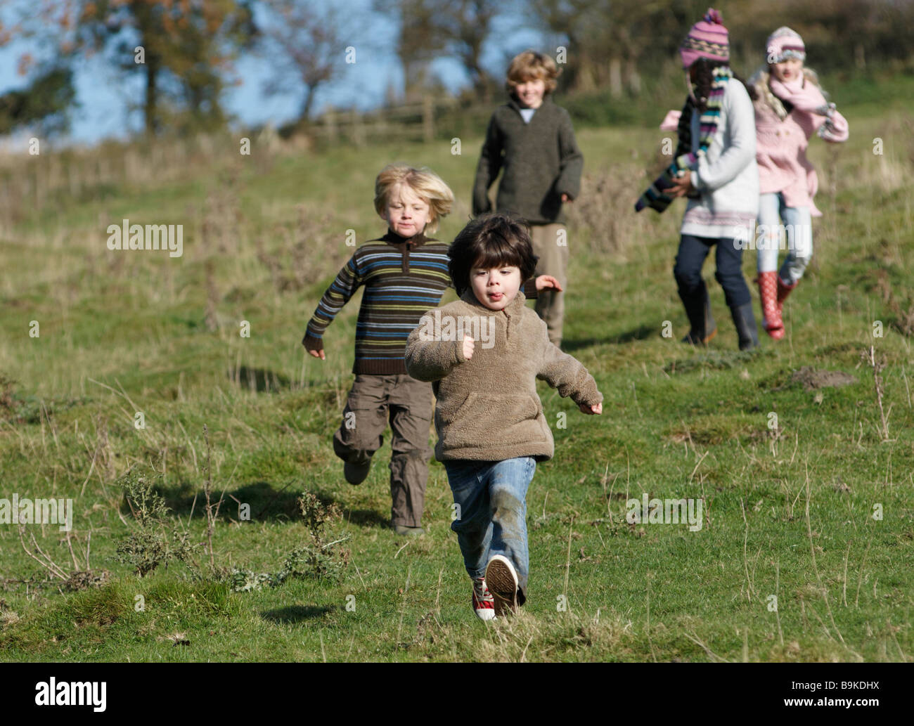 Children running in countryside Stock Photo - Alamy