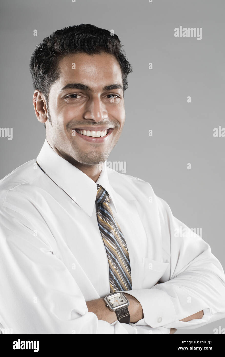 Portrait of a businessman smiling Stock Photo - Alamy