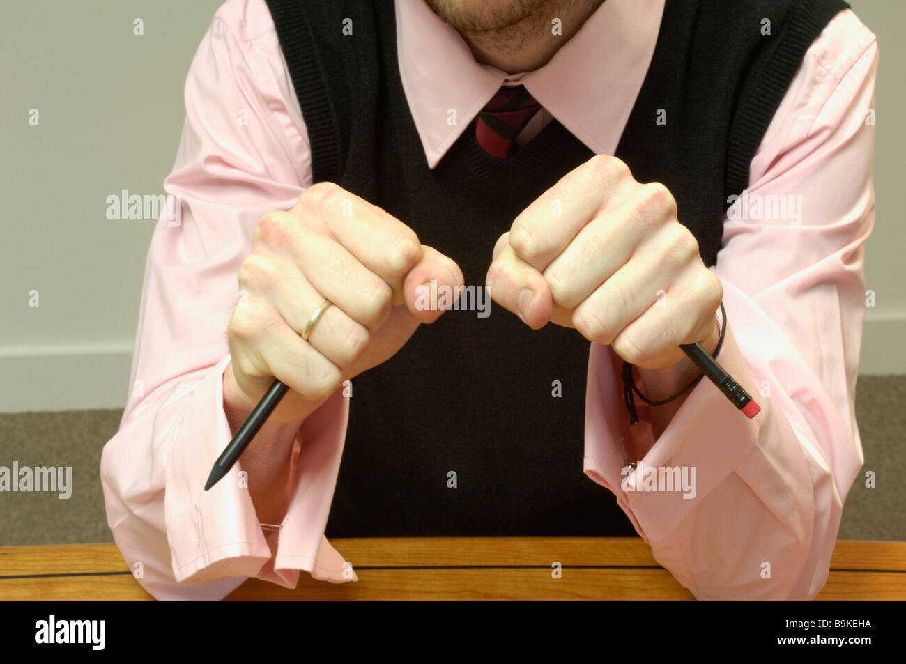 detail of businessman breaking pencil in two Stock Photo - Alamy
