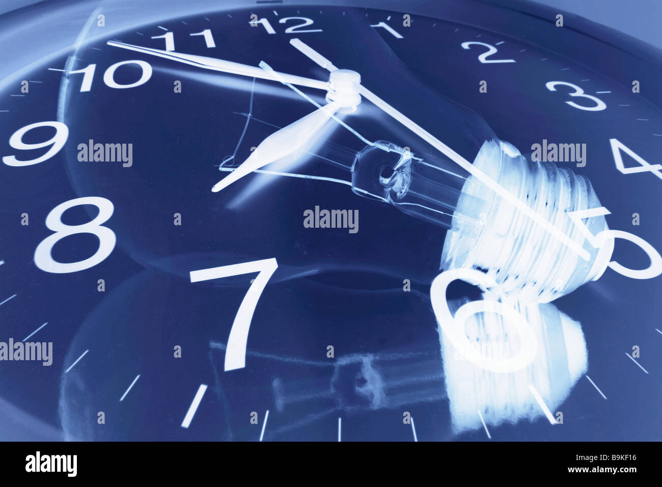 Clock and Light Bulb Stock Photo - Alamy
