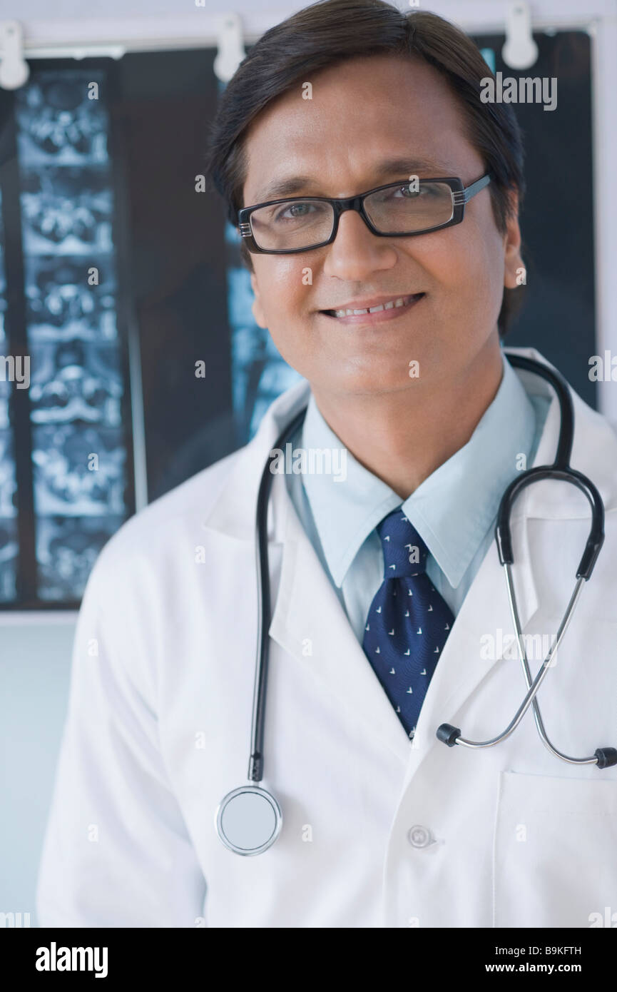 Portrait of a doctor smiling Stock Photo - Alamy