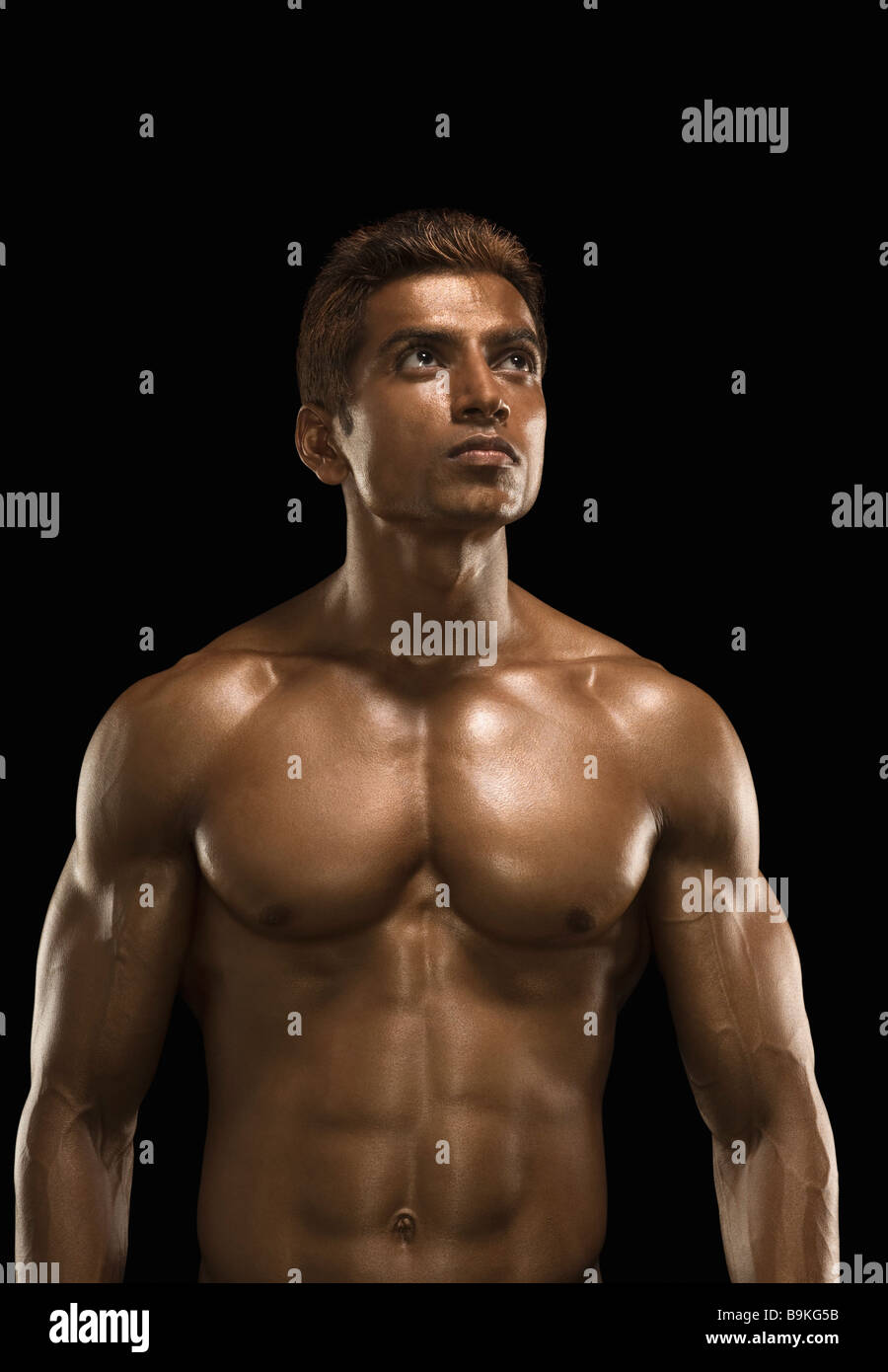 Close-up of a man flexing muscles Stock Photo - Alamy