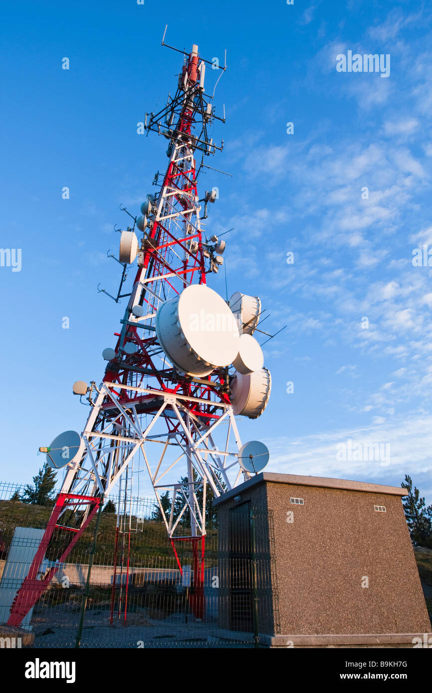 Telecommunications tower with parabolic antennas over a blue sky Stock ...