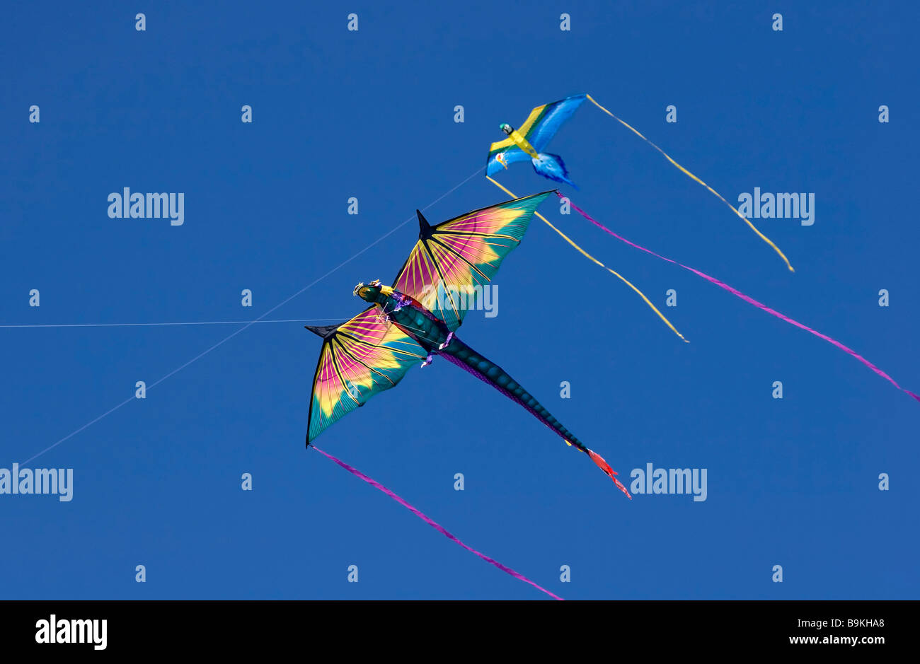 High flying kites against a blue sky Stock Photo - Alamy