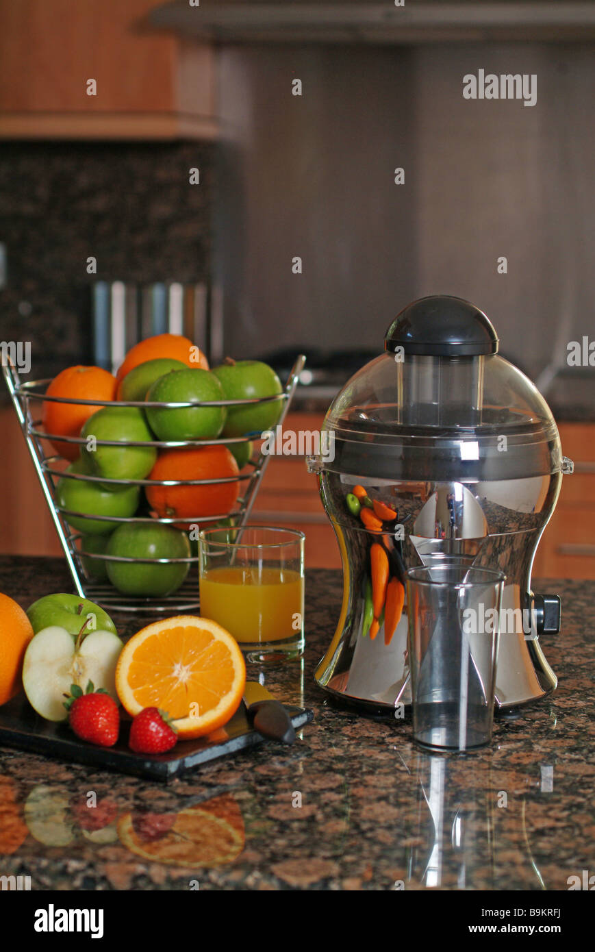 fruit and juicer in kitchen Stock Photo - Alamy