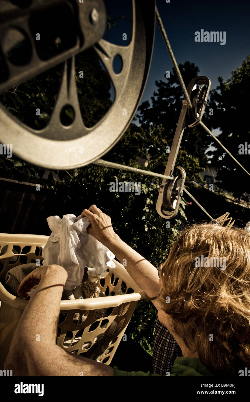 Hanging clothes on a clothesline Stock Photo - Alamy