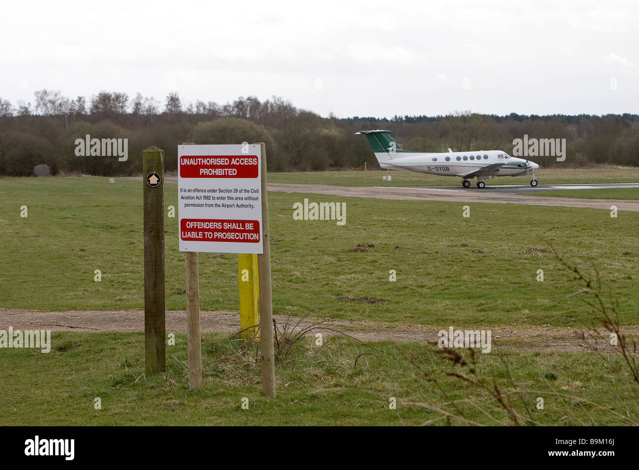 Airplane waiting to take off with warning sign in the foreground Stock ...