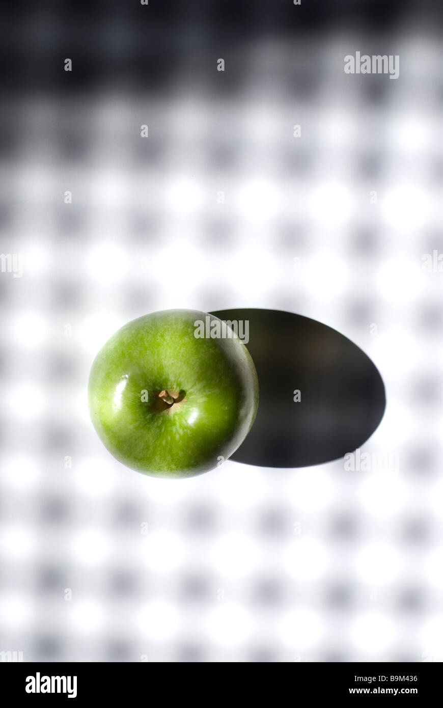 green apple on table - backgroung shadows Stock Photo - Alamy