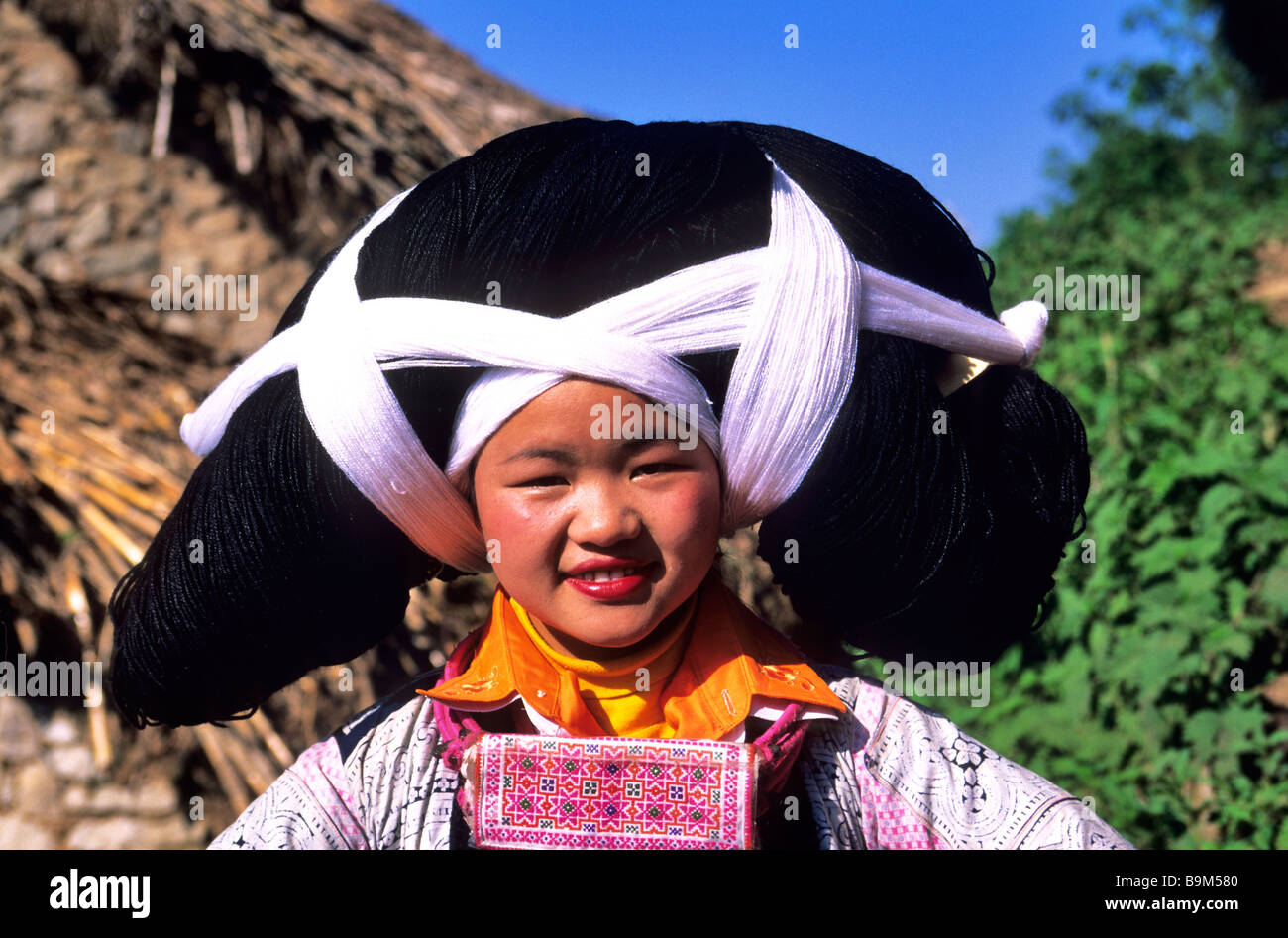 China, Guizhou province, Longhorn Miaos ethnic group woman wearing wool ...