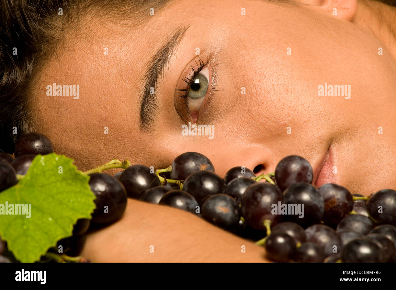 woman face with grapes Stock Photo - Alamy