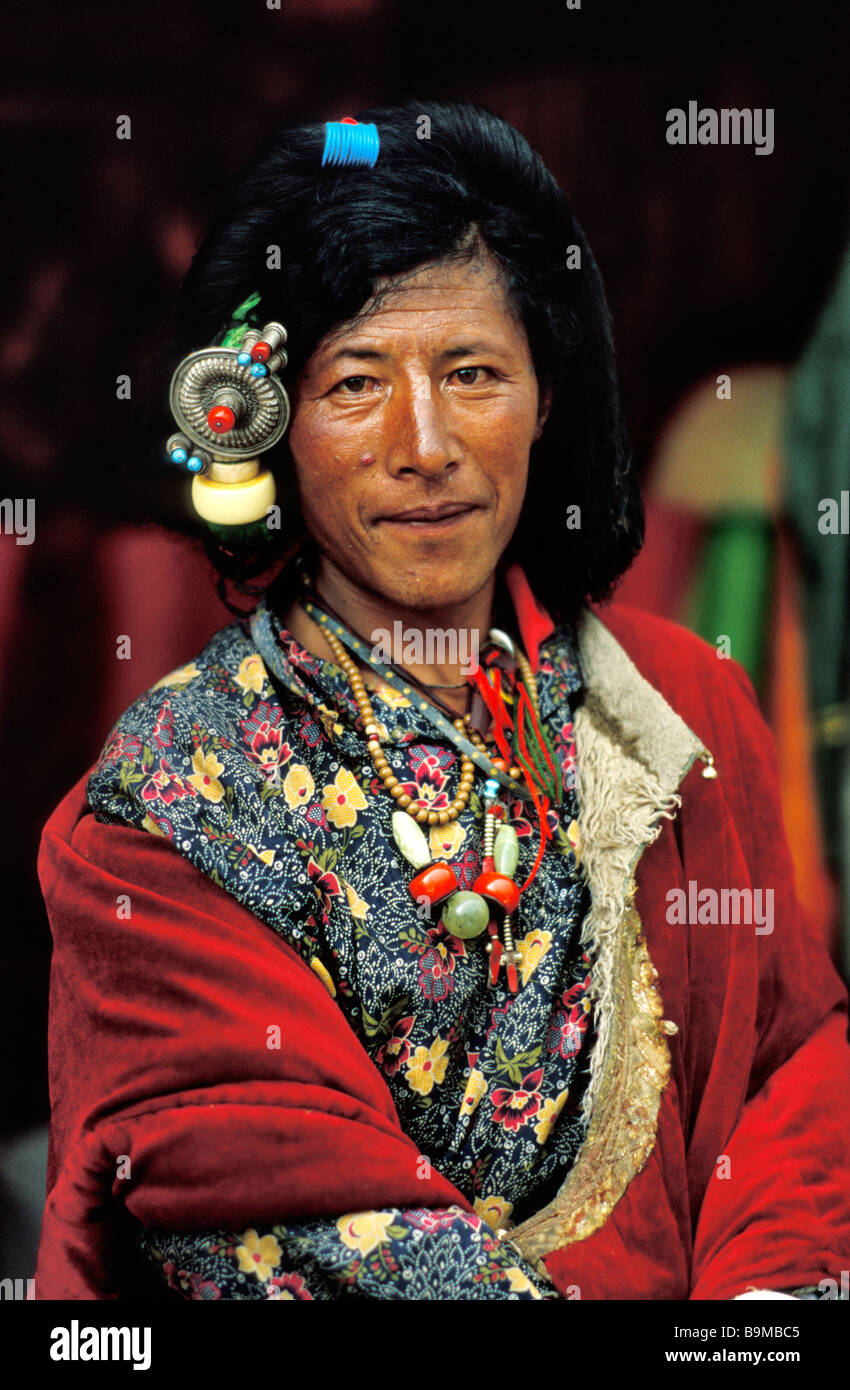China, Sichuan province, Litang, a Khampas man wearing a chuba, a coat ...