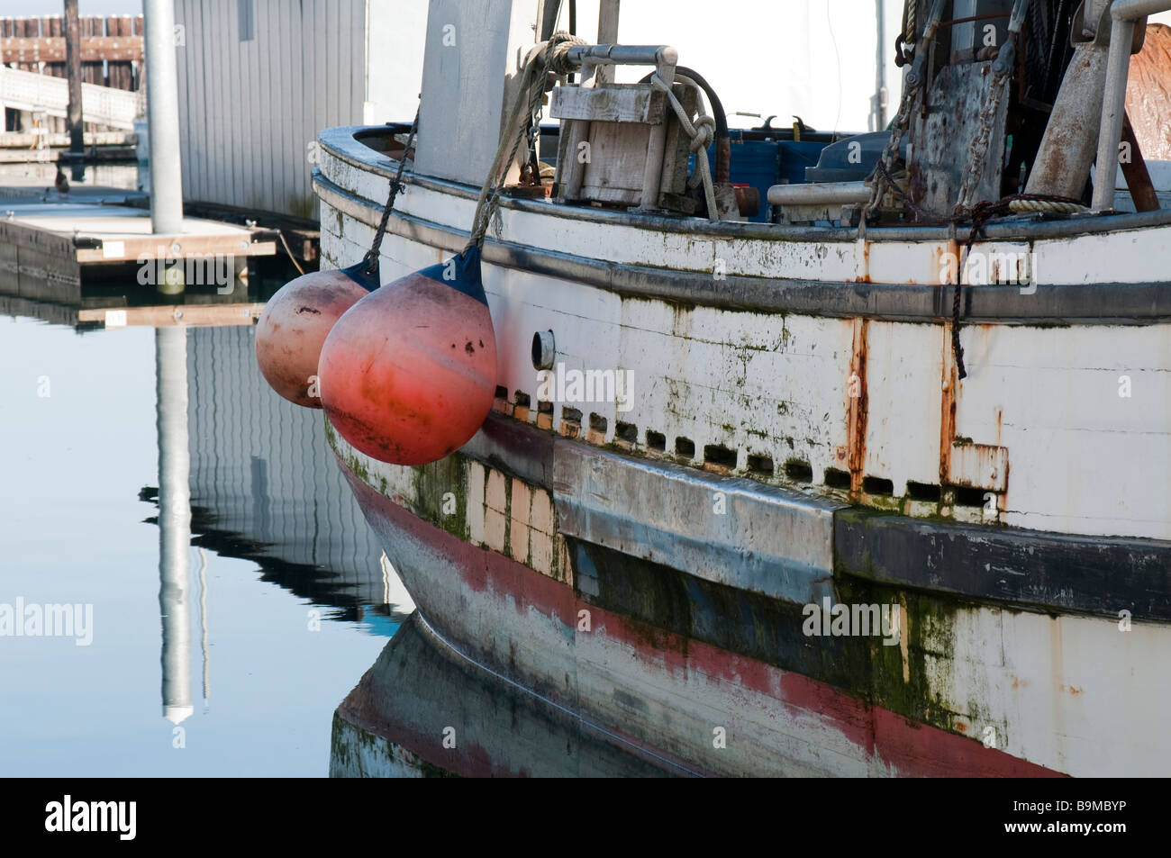 Fishing boat buoyed Stock Photo - Alamy