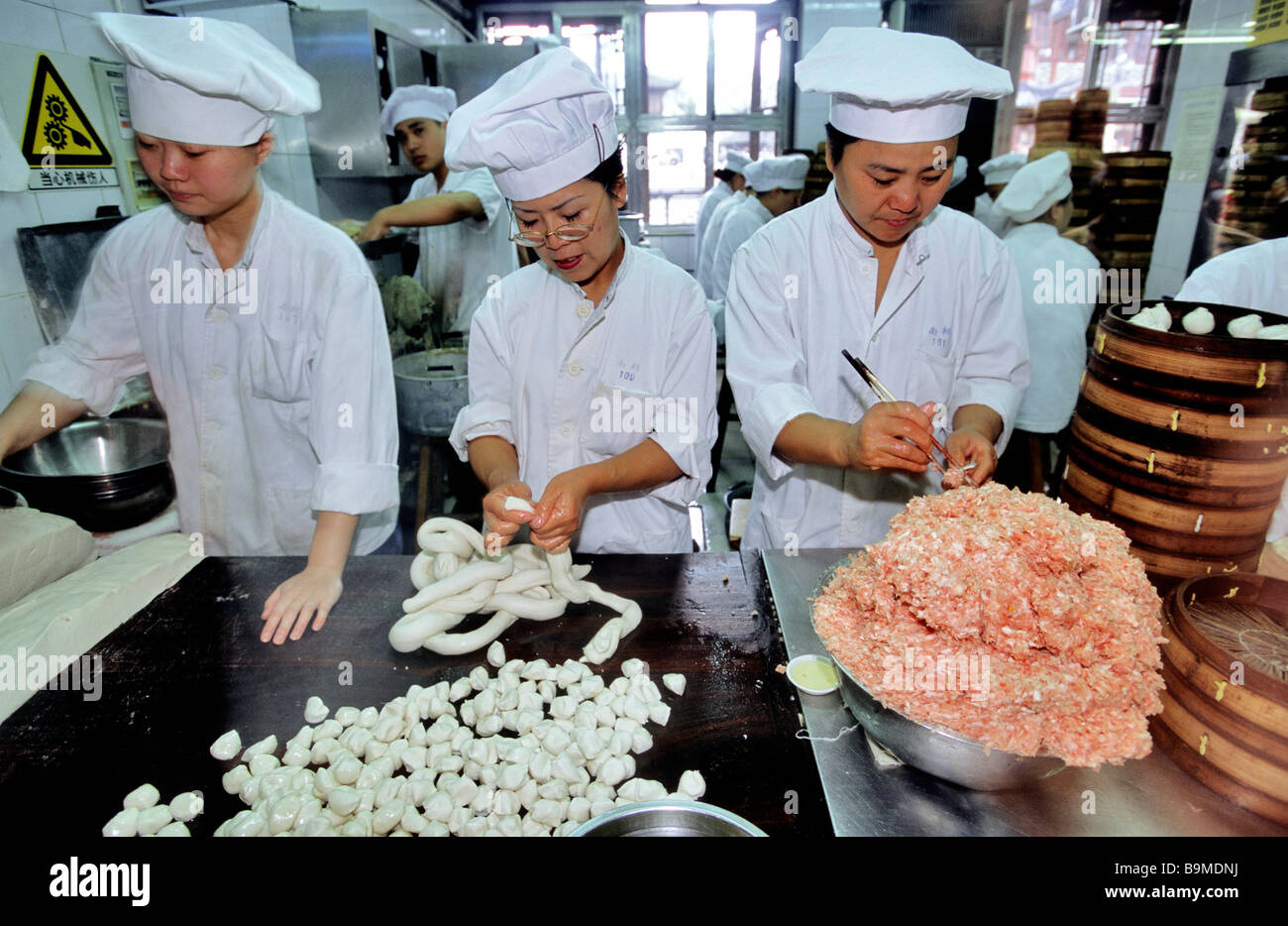 Old chinese woman cooking hi-res stock photography and images - Alamy