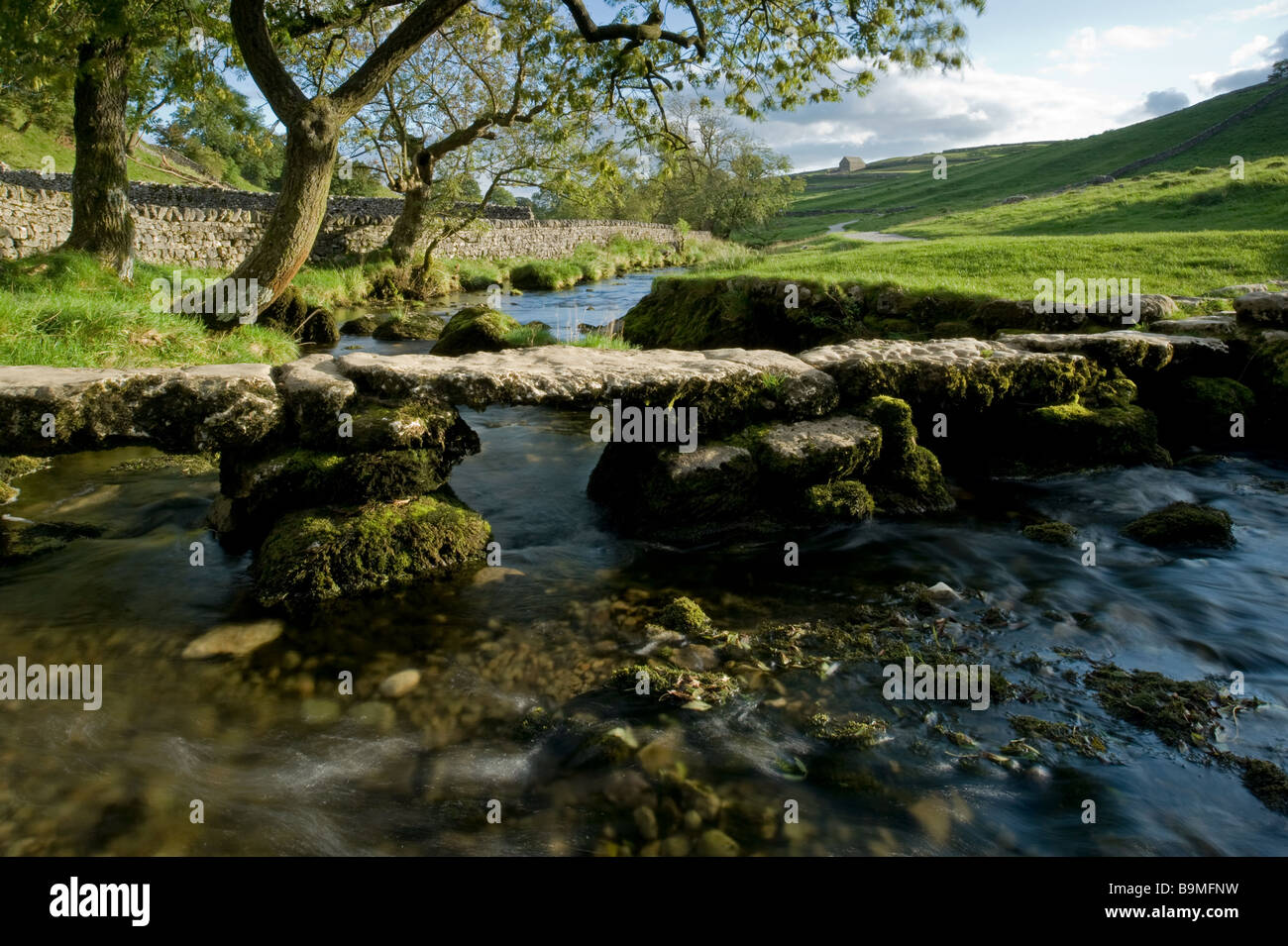 Clapper bridge over Malham Beck, Malham Cove, North Yorkshire Stock ...