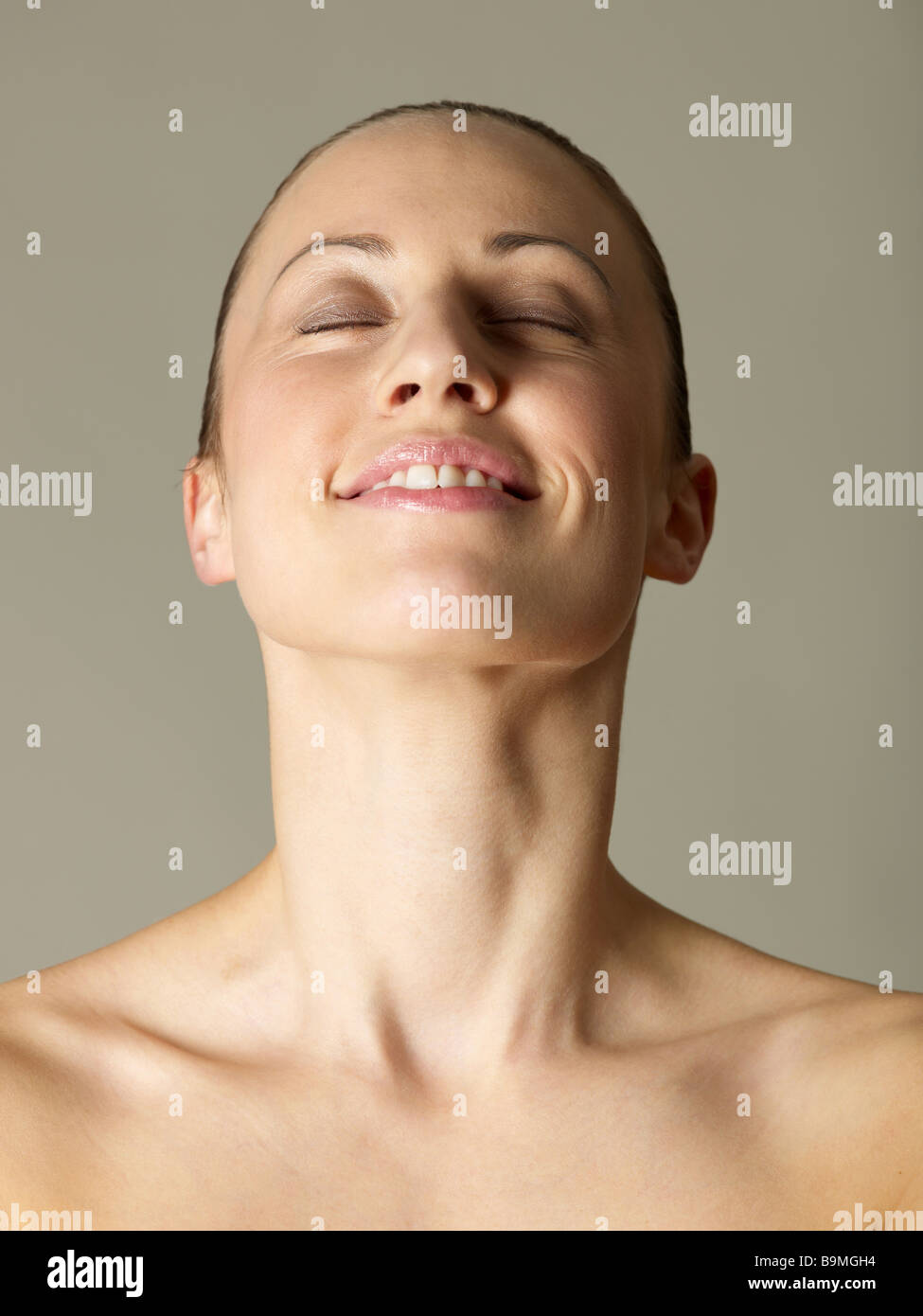 female model eyes shut smiling Stock Photo - Alamy