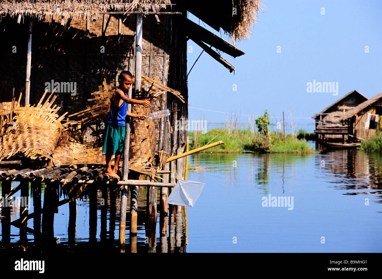 Myanmar (Burma), Shan State, Lake Inle, Pa Pa village, child playing ...
