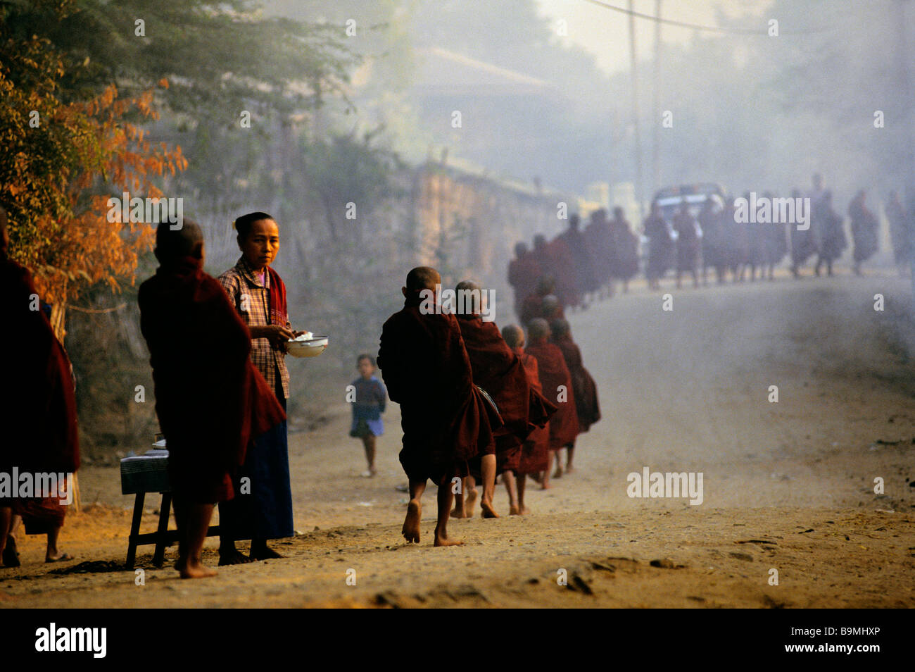 Monk begging in early morning hi-res stock photography and images - Alamy