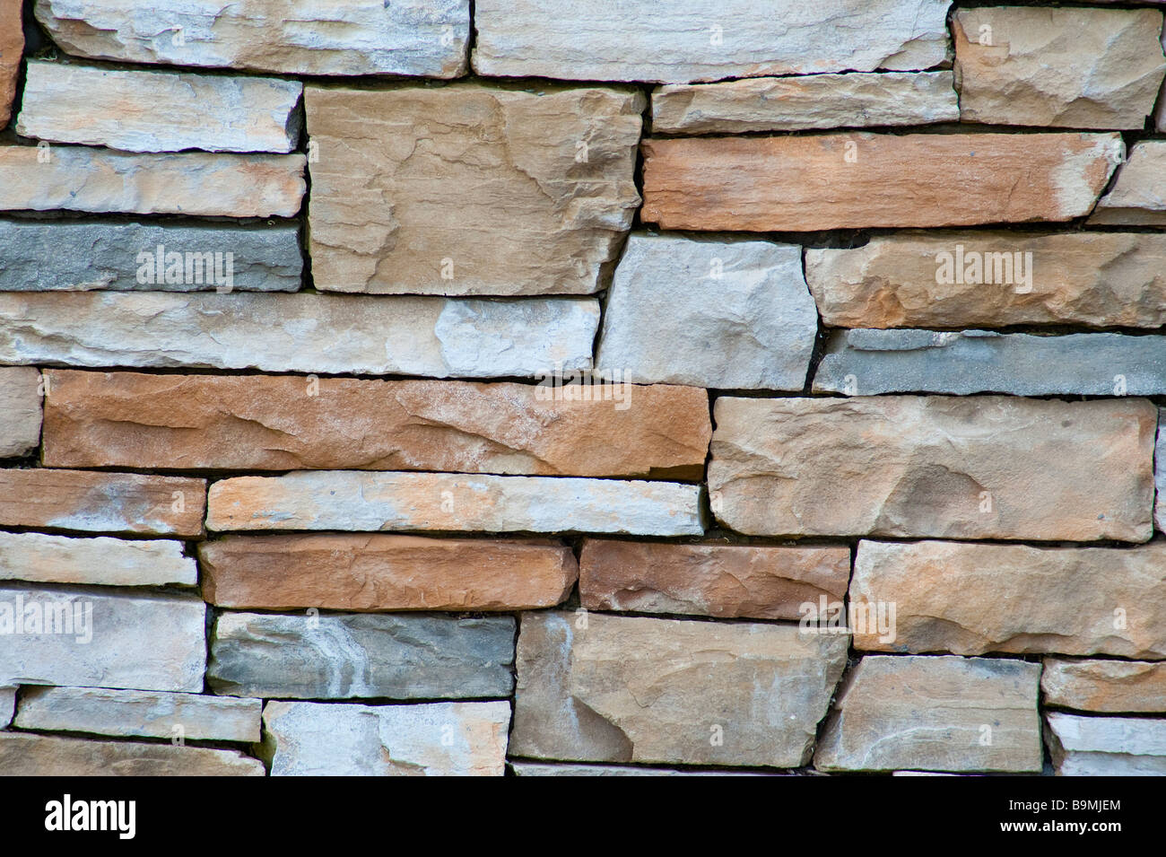 A wall of pale sandstone bricks good for a texture Stock Photo - Alamy