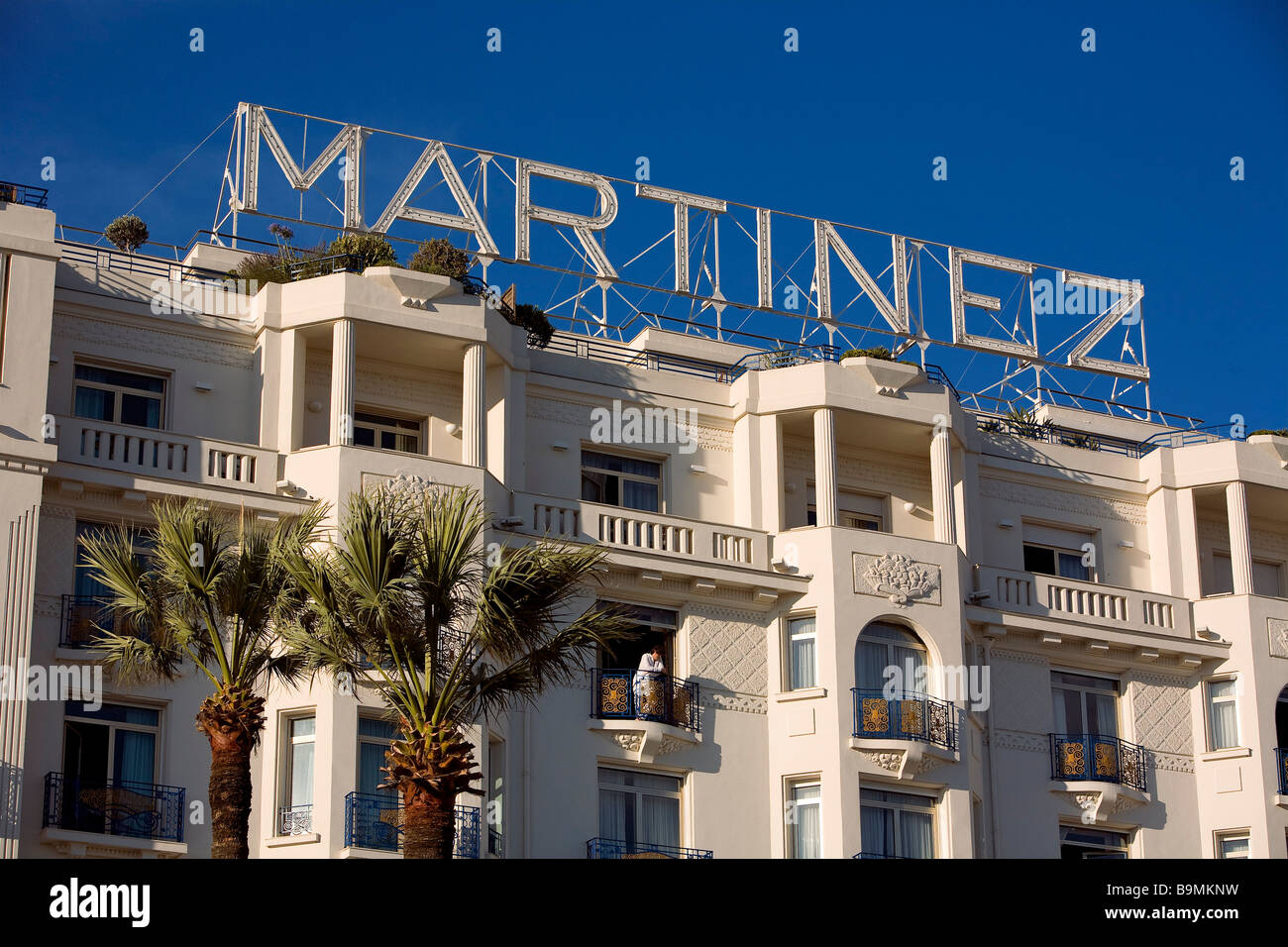 France, Alpes Maritimes, Cannes, palm tree and et Hotel Martinez facade ...