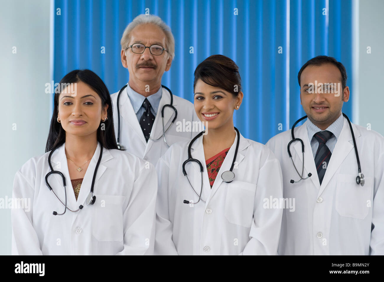 Portrait of doctors smiling Stock Photo - Alamy