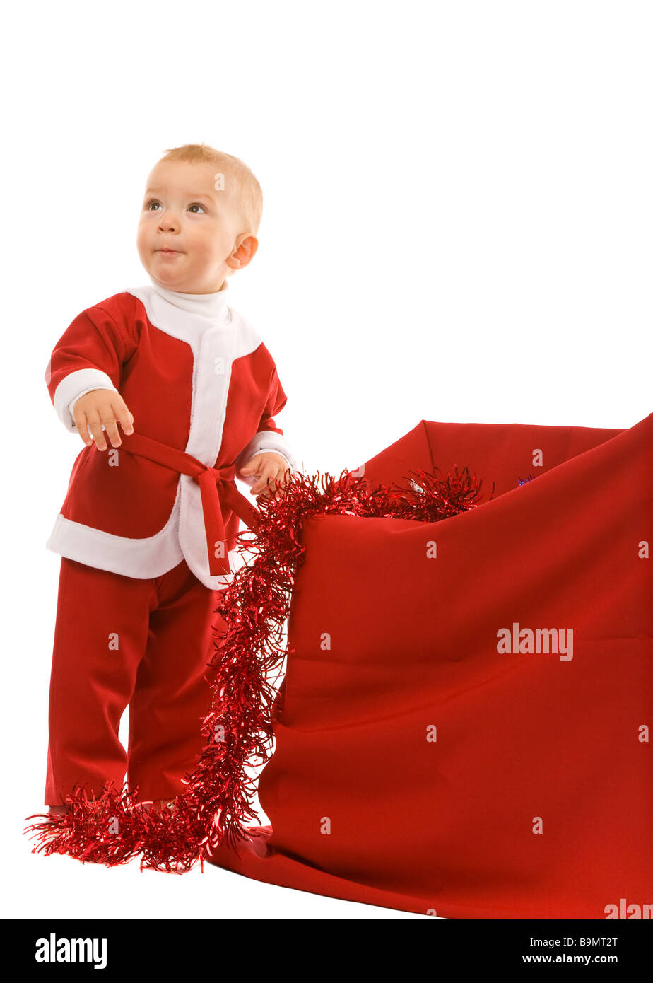 little boy dressed as Santa Claus on a white background Stock Photo - Alamy