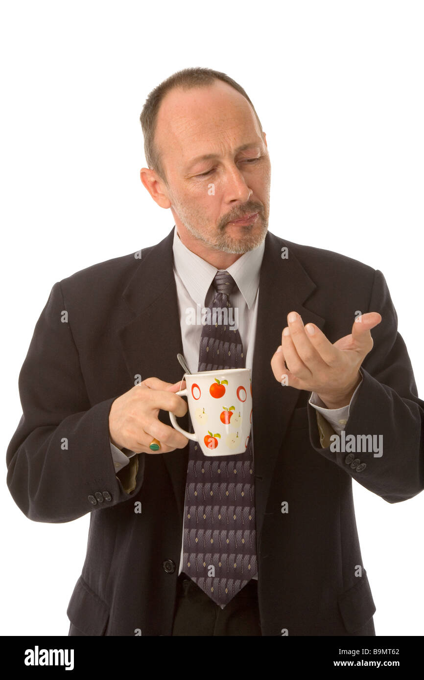 the mature man with cup isolated on white background Stock Photo - Alamy