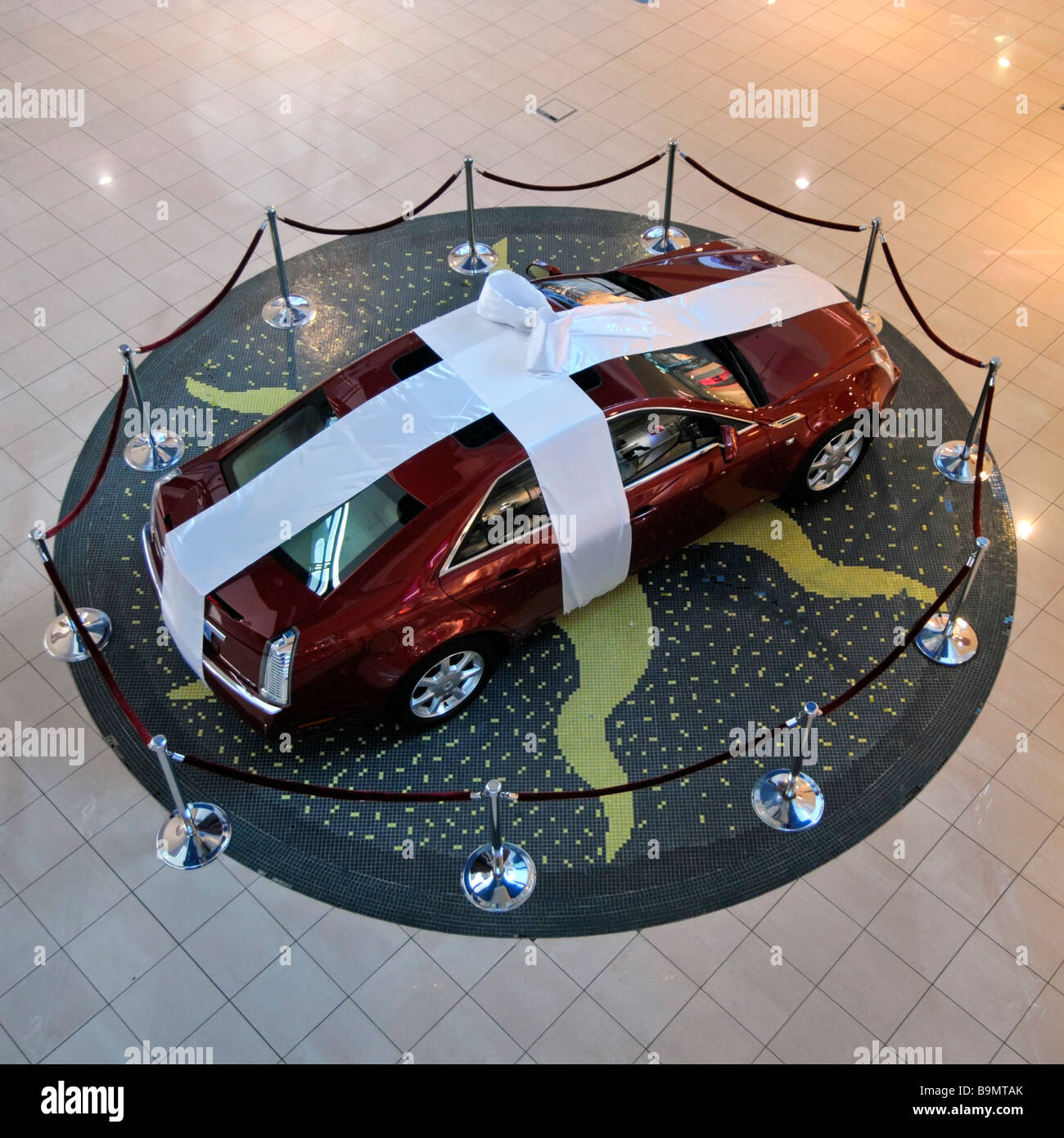 Abu Dhabi Marina shopping mall looking down on a new car wrapped in ...
