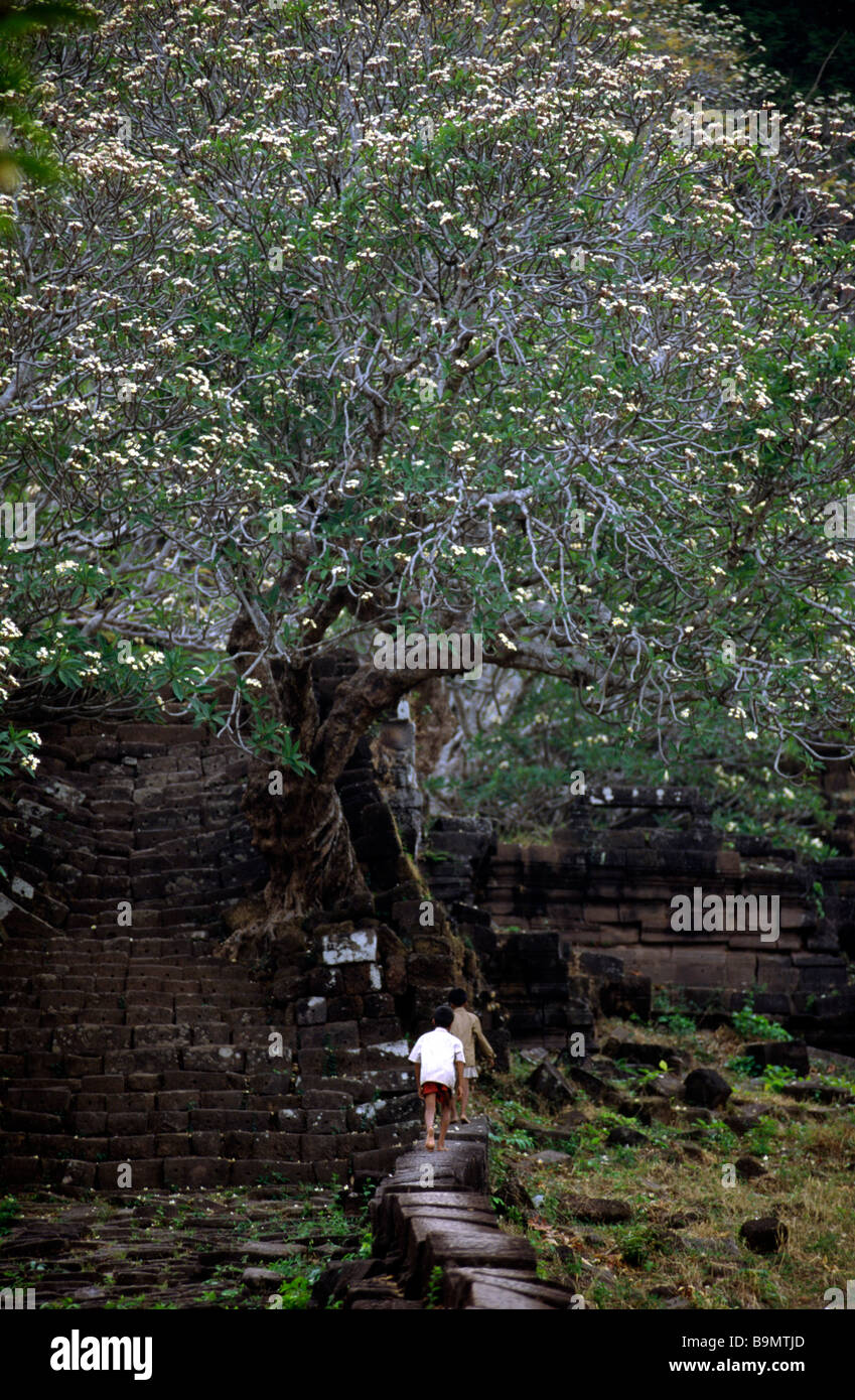 Laos, Champassak Province, children climbing up the main stairs of the ...