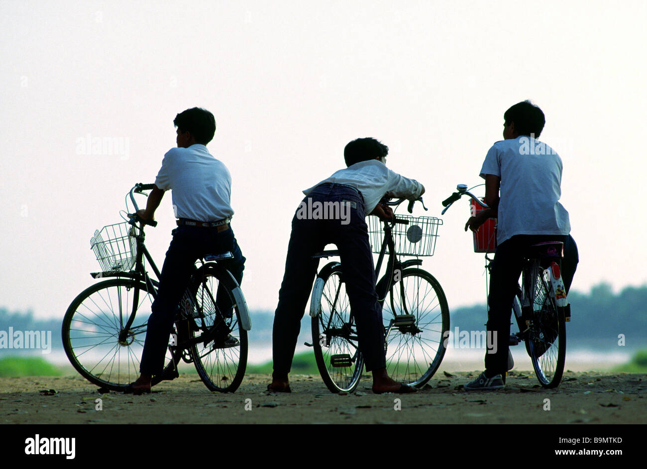 Laos, Viangchan, teenagers on bicycle back from school Stock Photo - Alamy