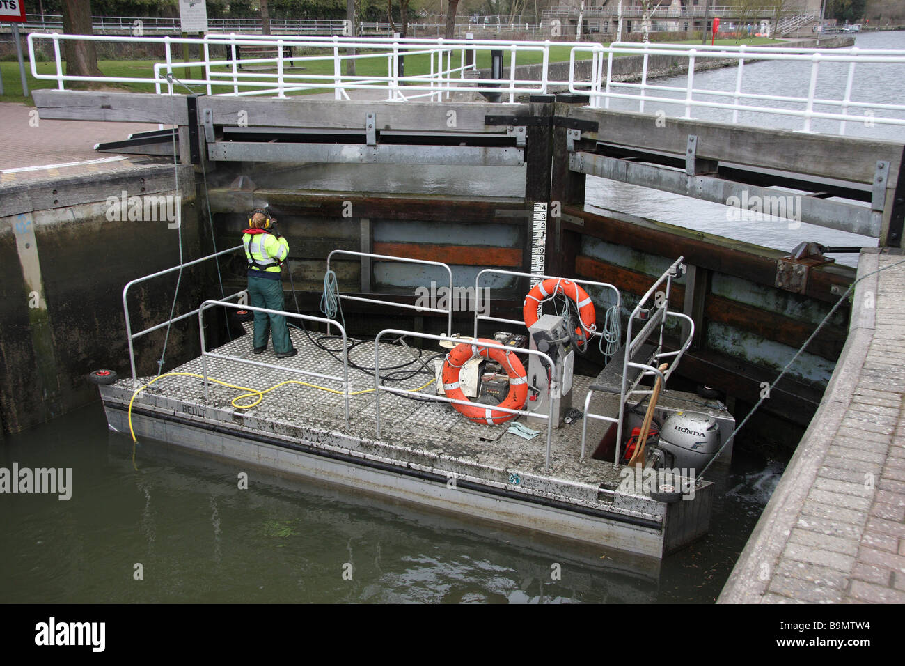 river medway lock gate cleaning chamber woman at work people person ...