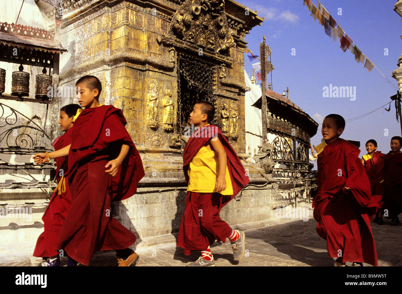 Nepal, Kathmandu, young tibetan boys turning around the Swayambhunath ...
