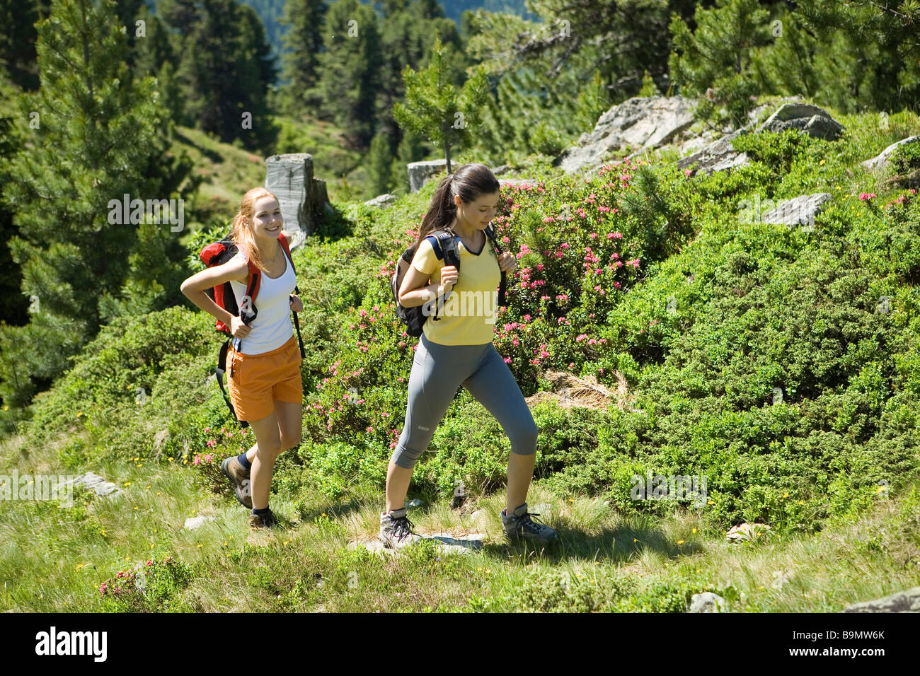 Two young women trekking in the mountains Stock Photo - Alamy