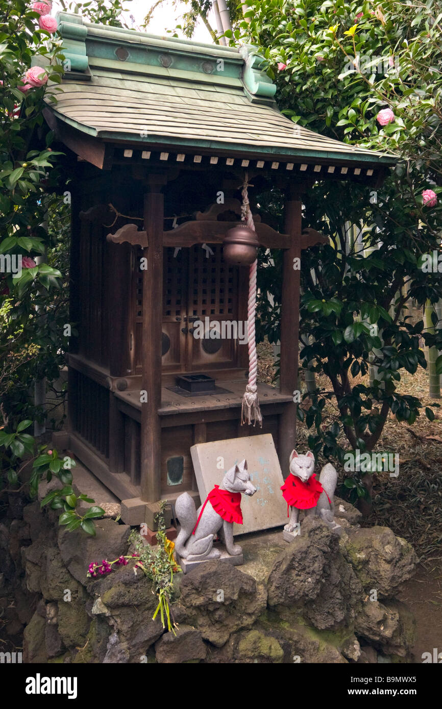 Small shrine and a pair of stone-carved guardian dogs - Tokyo, Japan ...