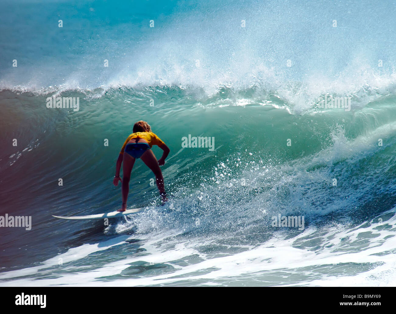 Surfer girl riding wave hi-res stock photography and images - Alamy