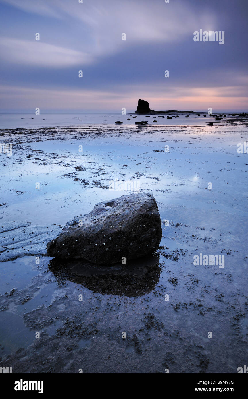 The sea stack Black Nab at sunrise in Saltwick Bay near Whitby ...