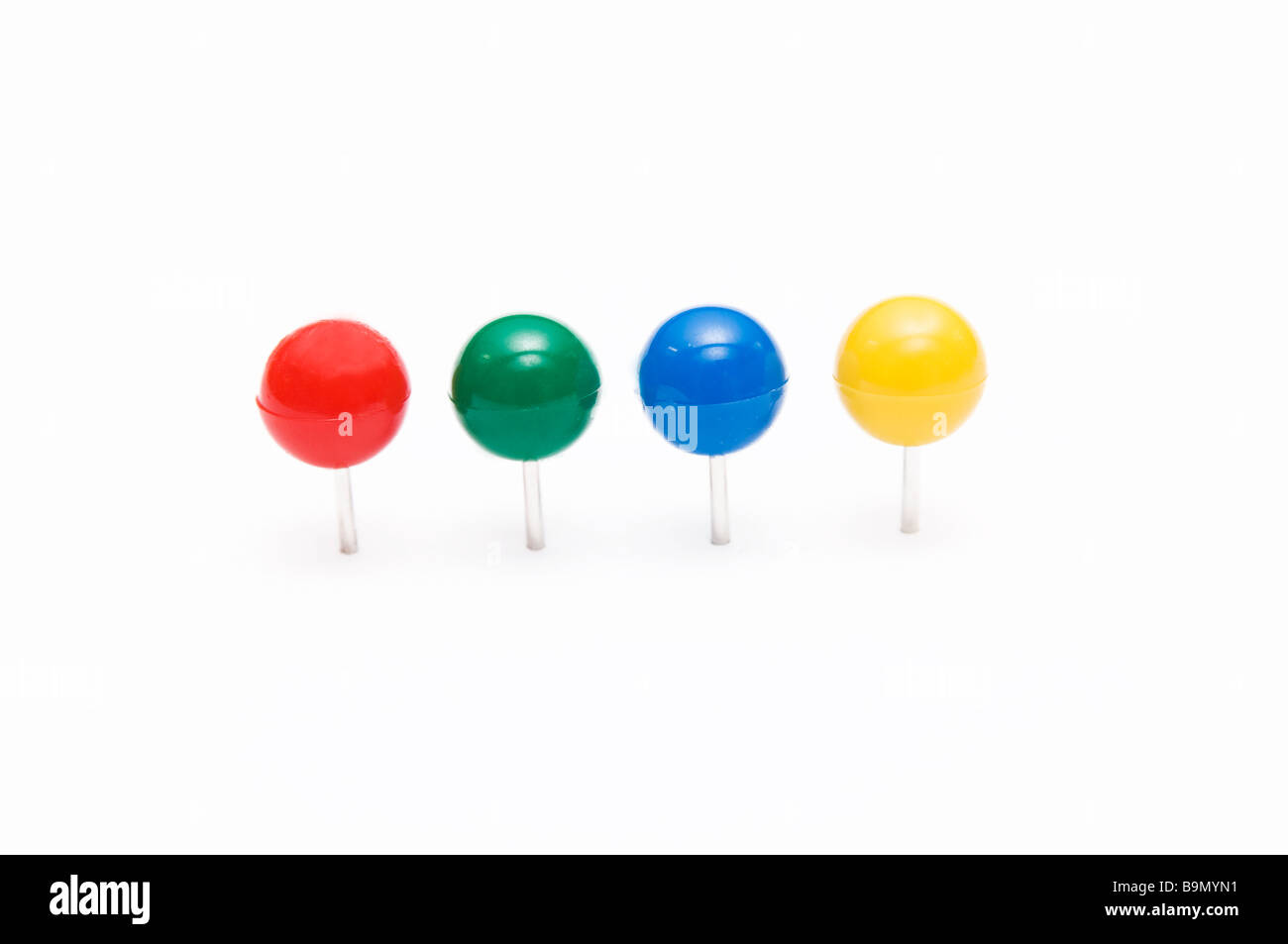 color pins isolated on a white background Stock Photo - Alamy