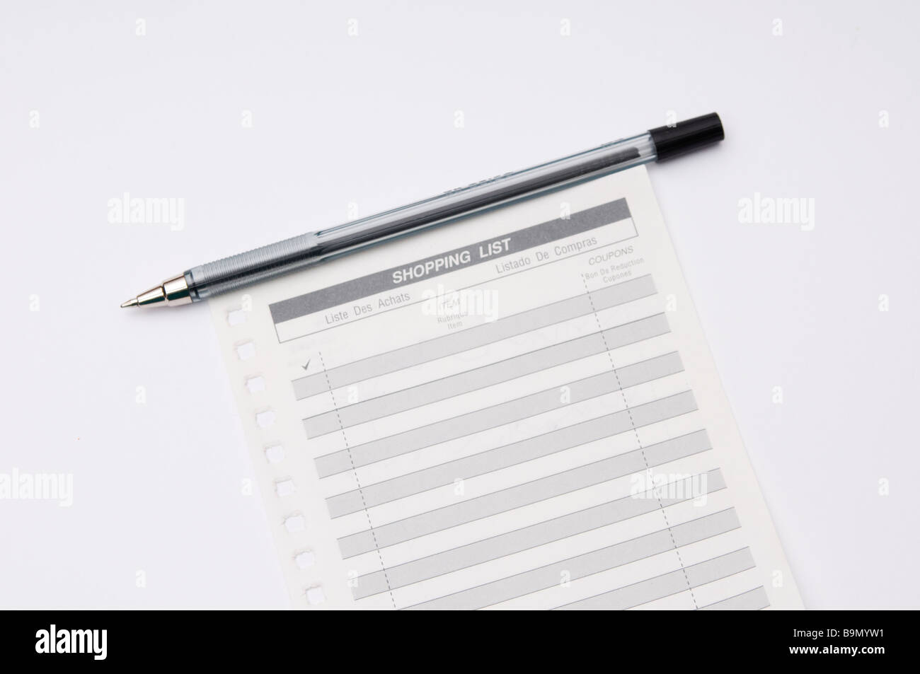Shoping list with pen isolated on a white background Stock Photo - Alamy