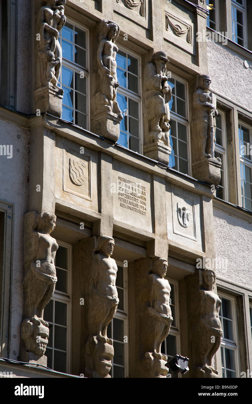 Building facade with carved stone figures Munich Germany Stock Photo ...